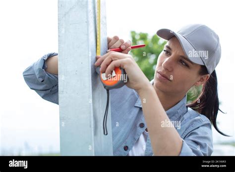Builder Worker Measure Height On Reinforcement Bars At Construction Site Stock Photo Alamy