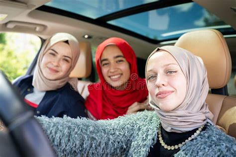 Group Of Female Friends Enjoying Road Trip Traveling At Vacation In The