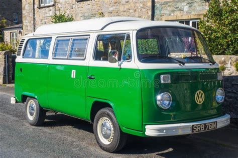 Classiv Green Vw Campervan On The Side Of The Street Editorial Stock