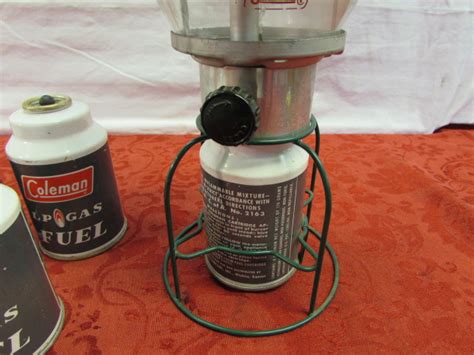 Lot Detail VINTAGE COLEMAN LANTERN WITH PYREX GLOBE FUEL REFILLS