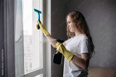 Side View Of Curly Girl Wearing In White Shirt And Yellow Protective