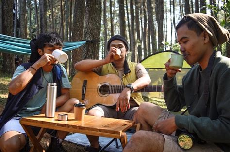 Premium Photo Group Of Asian Young Male Friends Enjoying Drink Coffee