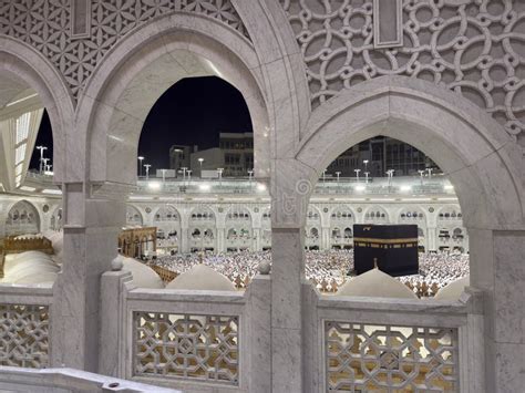 Night View Of The Kaaba And Pilgrims In Masjid Al Haram Framed By