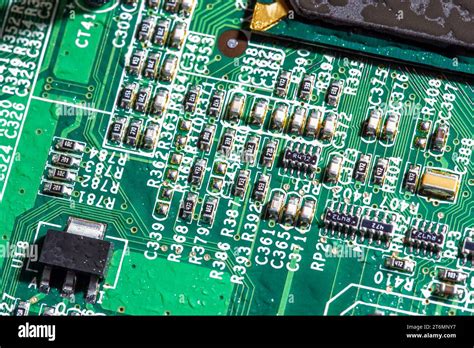 Wet Digital Circuit Board With Microprocessors And Components Closeup
