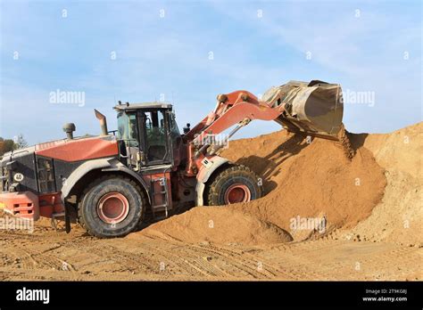 Wheel Loader Loads Truck With Gravel In A Sand Pit Transport And