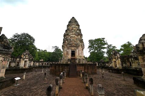 Laterite Passageway Delineated By Stone Pillars Leading To The Main