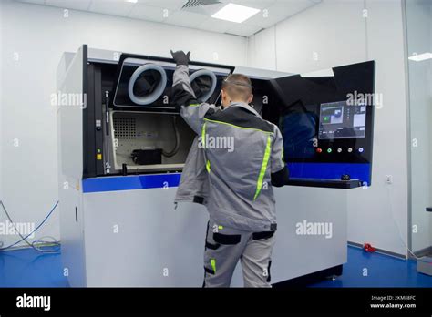 The Worker Controls Workflow Inside Large Industrial 3d Printer