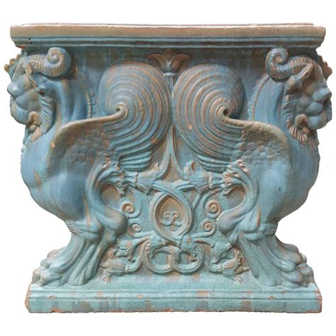 An Ornate Blue Vase With Two Birds On It