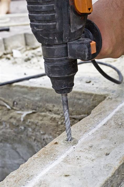 Construc Worker Fixing The Pavestone On The Roadtion Worker Installing