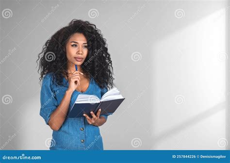 Thoughtful Attractive African American Businesswoman Is Standing Stock