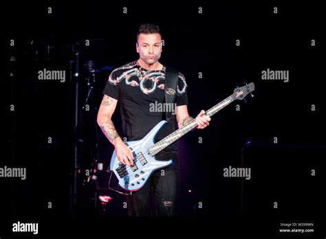Chris Wolstenholme Bassist Of The The English Band Muse Performing