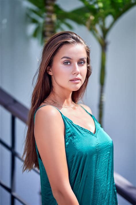 Close Up Portrait Of Beautiful Girl In A Green Dress Stock Image