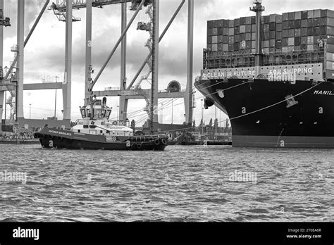 The Tug Svitzer Bargate Passing In Front Of The Ulcs Manila Express In