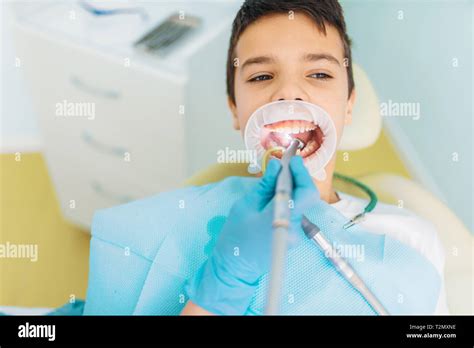 Caries Removal Procedure Pediatric Dentistry Female Dentist Drilling