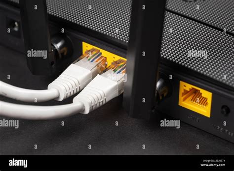 Connect An Ethernet Cable To A Wireless Router On Dark Ethernet Rj45 And Electric Cables