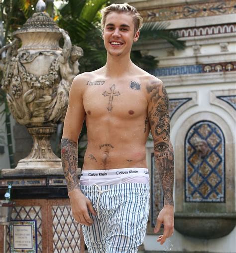 Hes No Angel Justin Bieber Shows Off New Tattoo Pair Of Wings On