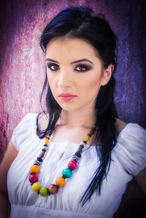 Beautiful Brunette Girl With Big Eyes And White Dress Smiling N Stock