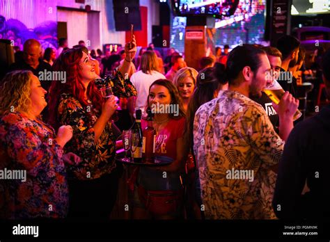 Inside A Coyote Ugly Bar Where Women Dance On The Bar As People Order