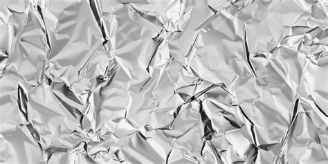 Premium Photo Shiny Crumpled Silver Foil Texture Background