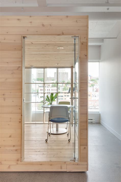 Wooden Walkway Traverses OVH Office Interior By Pierre Thibault