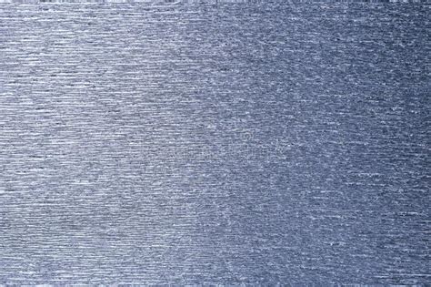 Textural Of Silver Background Of Wavy Corrugated Paper Closeup Stock