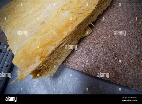 Red Bricks And Glass Wool Laying On The Concrete Floor At Construction