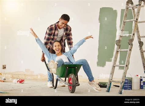 DIY Painting And Happy Couple Smile While Moving Into New Home Real