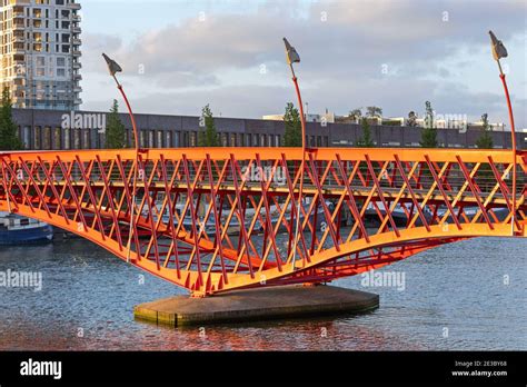 Red Python Bridge Pillar Structure In Amsterdam Netherlands Stock Photo
