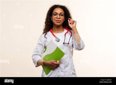 African American Woman Intern General Practitioner Hold Medical History