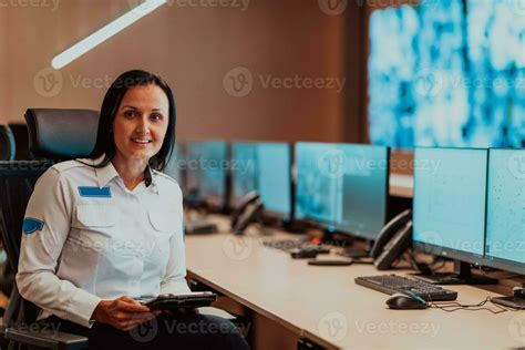 Female Security Operator Working In A Data System Control Room Offices Technical Operator