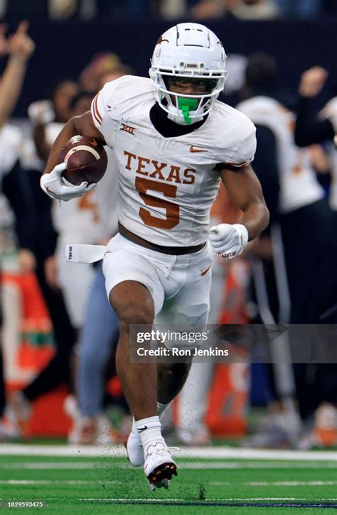 Wide Receiver Adonai Mitchell Of The Texas Longhorns Carries The Ball