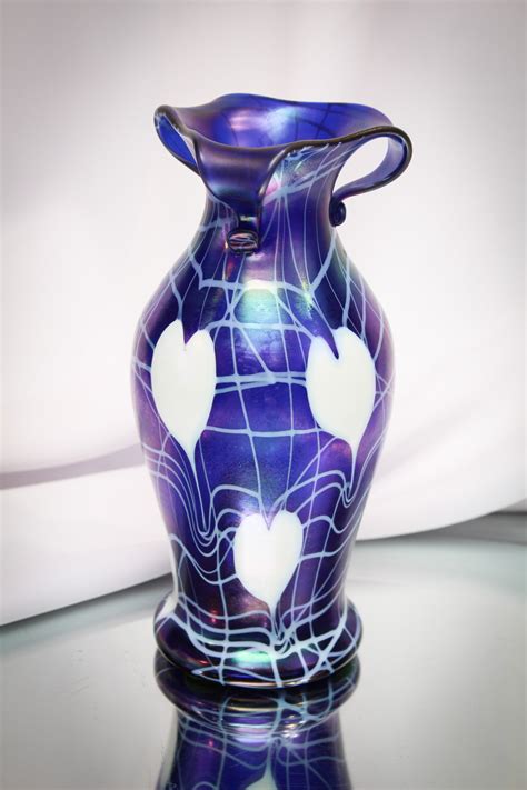 Imperial Freehand Glass Cobalt Irridescent Heart And Vine Handled Vase