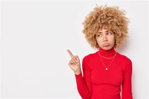 Free Photo Emotional Cheerful Woman With Curly Bushy Hair Triumphs