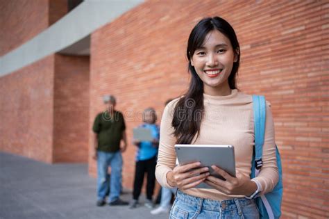 Young And Cute Asian College Student Girls Smile Carrying A Backpack