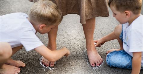 Two Small Sons Playing With Unrecognizable Mother On A Road In Park On A Summer Day Drawing