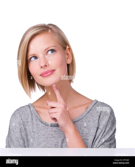 Je me demande une photo studio isolée d une belle jeune femme qui a l air pensive Photo Stock