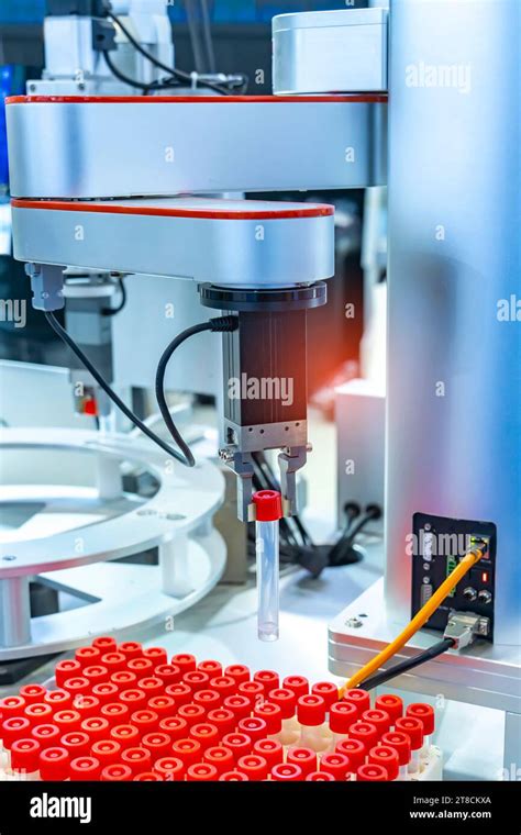 Robot Arm With Test Tube For Biological Experiments In Laboratory Stock