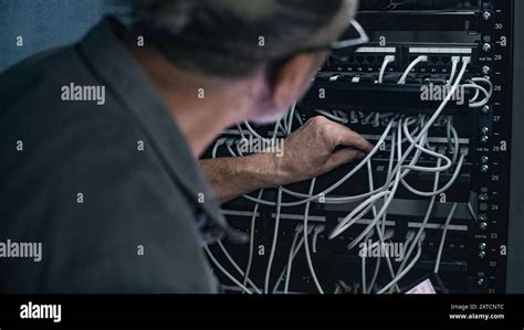Mature Specialist Works In Server Room Male Network Administrator