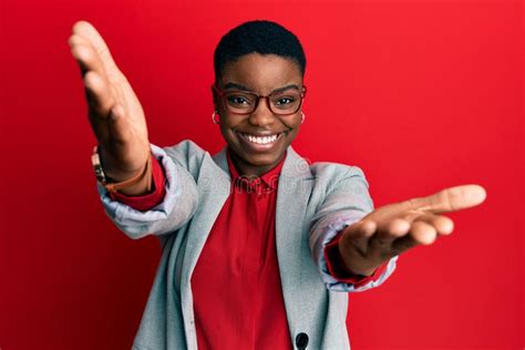 Young African American Woman Wearing Business Jacket And Glasses