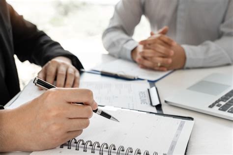 Premium Photo Midsection Of Businessman Taking Interview On Table