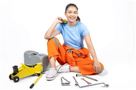 Premium Photo Asian Woman Car Technician In Uniform Sitting With A