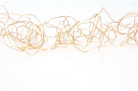 Premium Photo Close Up Of Illuminated String Lights Over White Background