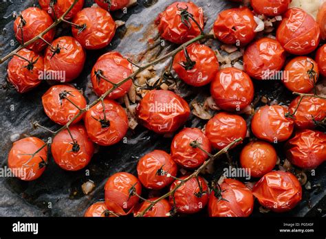 Baked Cherry Tomatoes With Oil And Garlic On Pan Stock Photo Alamy