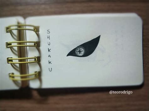 An Open Spiral Notebook With A Drawing Of A Leaf And The Words Shukku On It