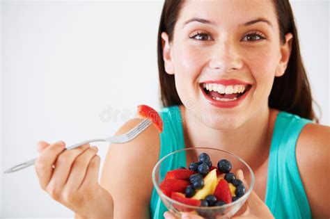 Happy That Her Diet Consists Of Fruit Salad Portrait Of A Beautiful