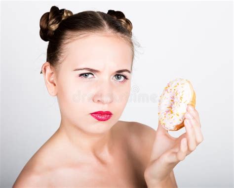 Girl In Bright Makeup Eating A Tasty Donut With Icing Funny Joyful