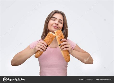 Delightful Young Woman Smell Fresh Baguette She Hold Both Piees In