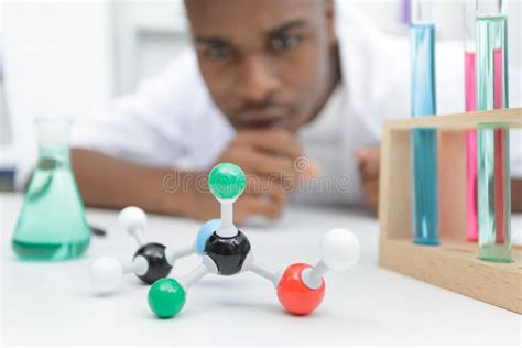 Scientist Examining Dna Model In Laboratory Stock Image Image Of Medical Cheerful