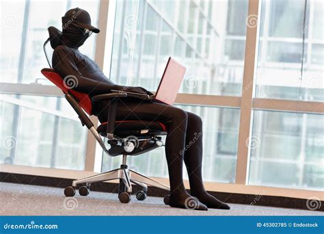 Anonymous Hacker Working With Laptop In Office Stock Image Image Of