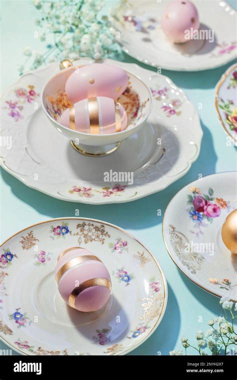 Aesthetic Easter Table Set Up Vintage Dishes Cups And Golden Eggs On